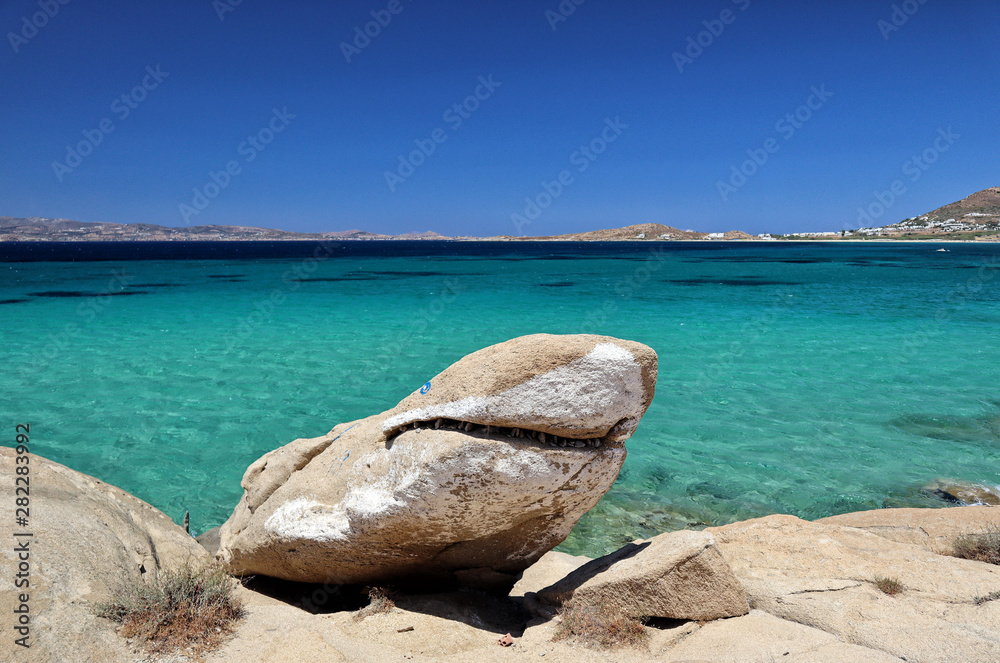 Great White Shark like rock with turquoise Aegean Sea in background ...