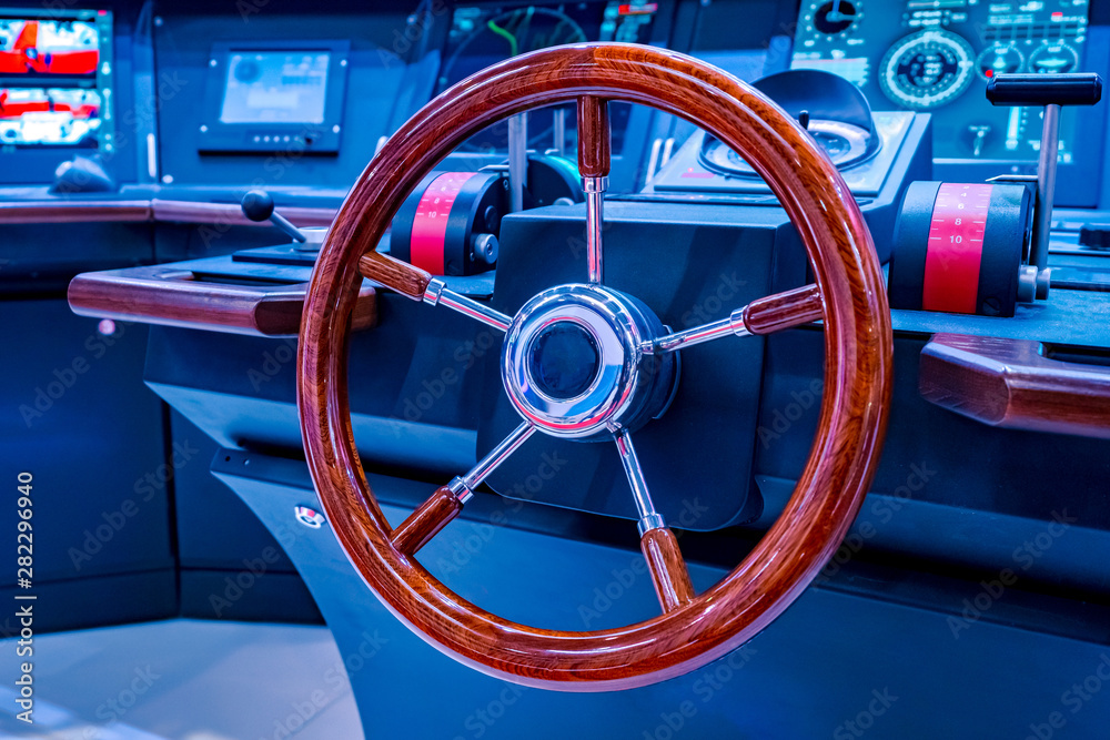 Steering wheel on the remote control ship. Steering wheel and ship ...