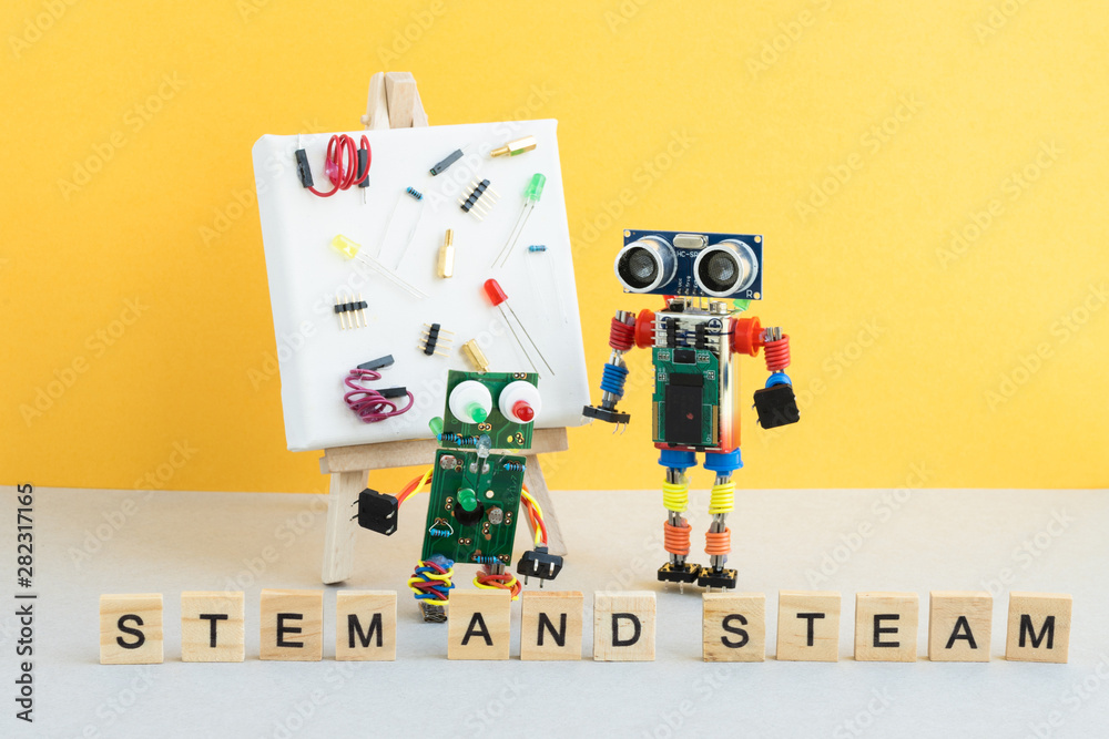 Back to school concept. A metal robot and an electronic board that can ...