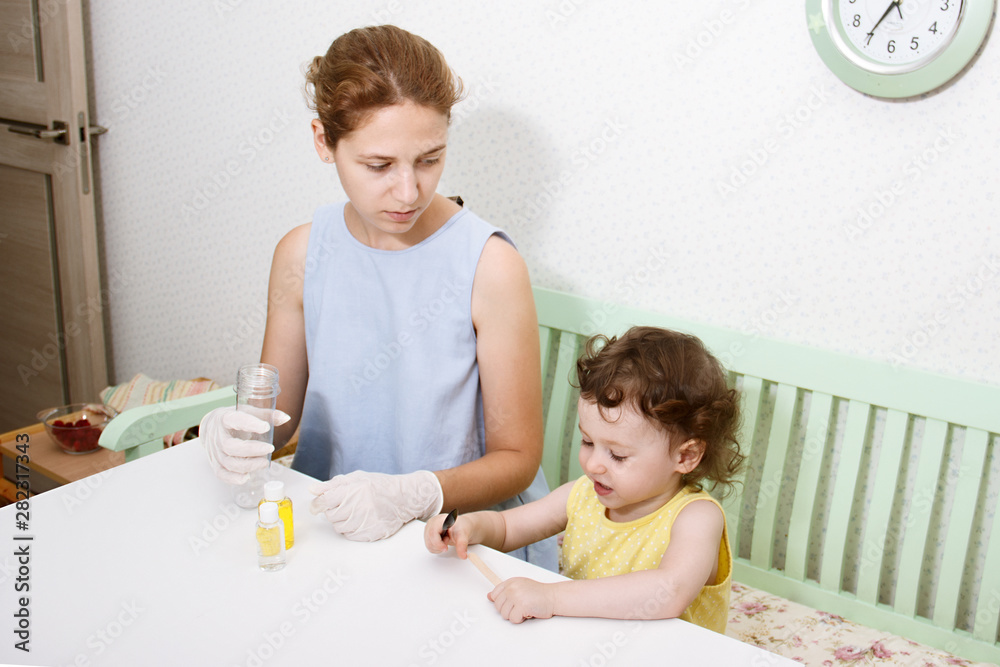 how to make slime. Mother and child mix ingredients homemade goop ...