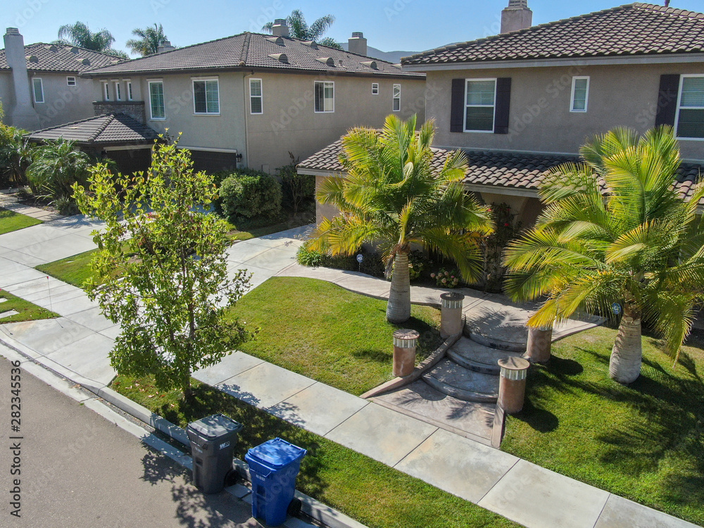 Suburban neighborhood street with big villas next to each other in ...