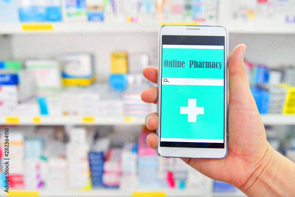 Pharmacist holding mobile smart phone for search bar on display in ...
