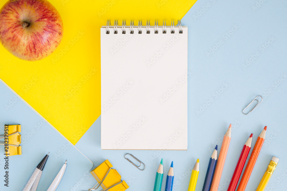 Bright stationery, notebook on blue yellow background. Back to school ...