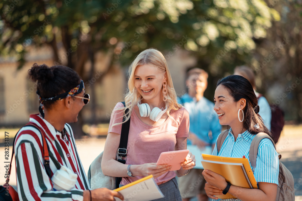 Students talking to each other after their classes. Stock Photo | Adobe ...