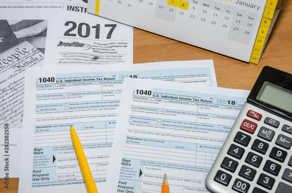 Photo & Art Print tax form 1040, calculator, notebook i pen on the ...