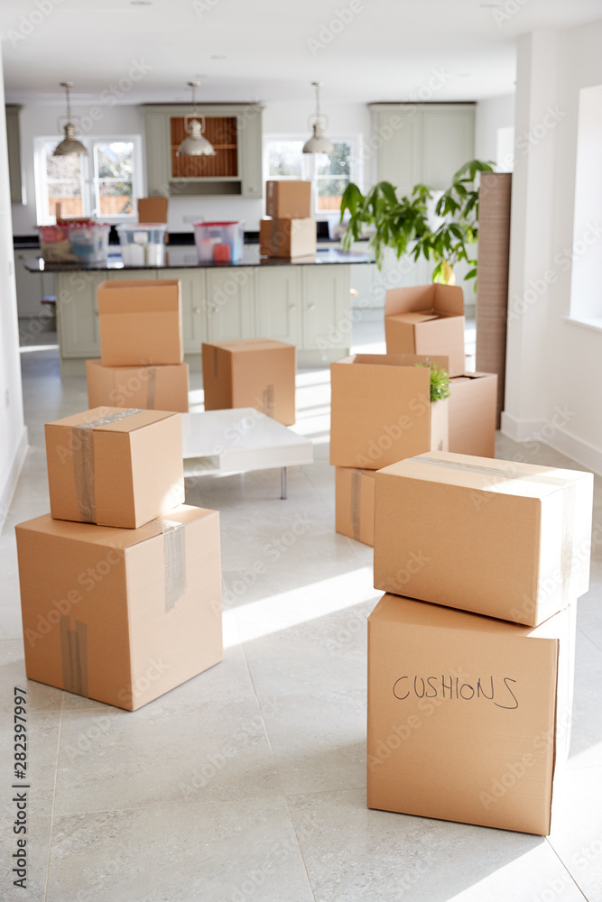 Stacked Removal Boxes In Empty Room On Moving Day Stock Photo | Adobe Stock