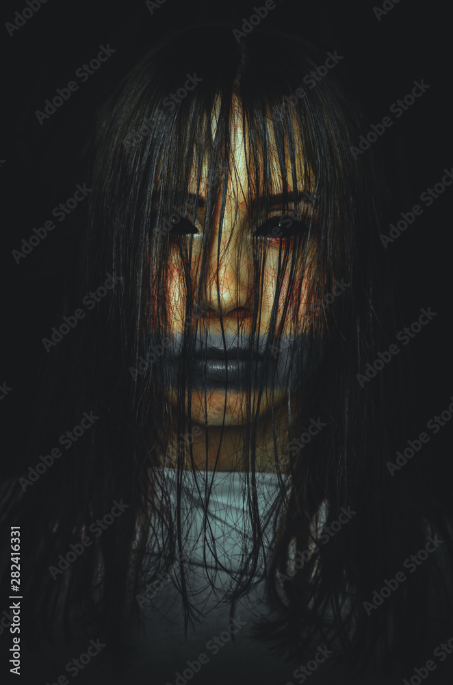 Scary witch with black eyes on dark background Stock Photo | Adobe Stock