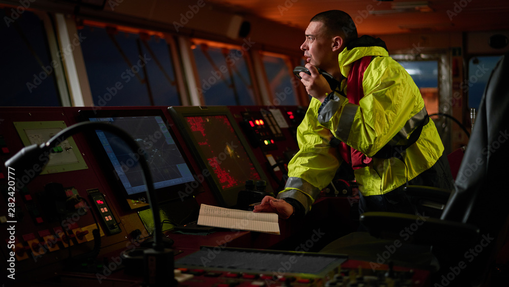 Navigator. pilot, captain as pat of ship crew performing daily duties ...