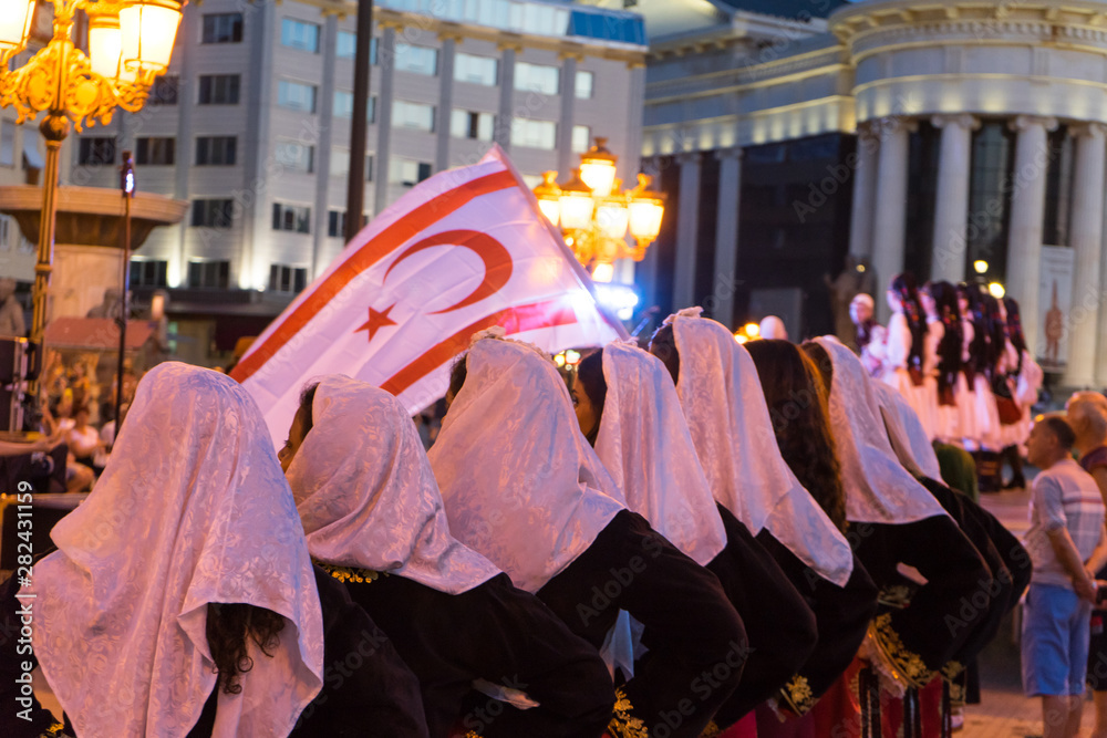 North Cyprus traditional costume and Big flag in a festival at Skopje ...