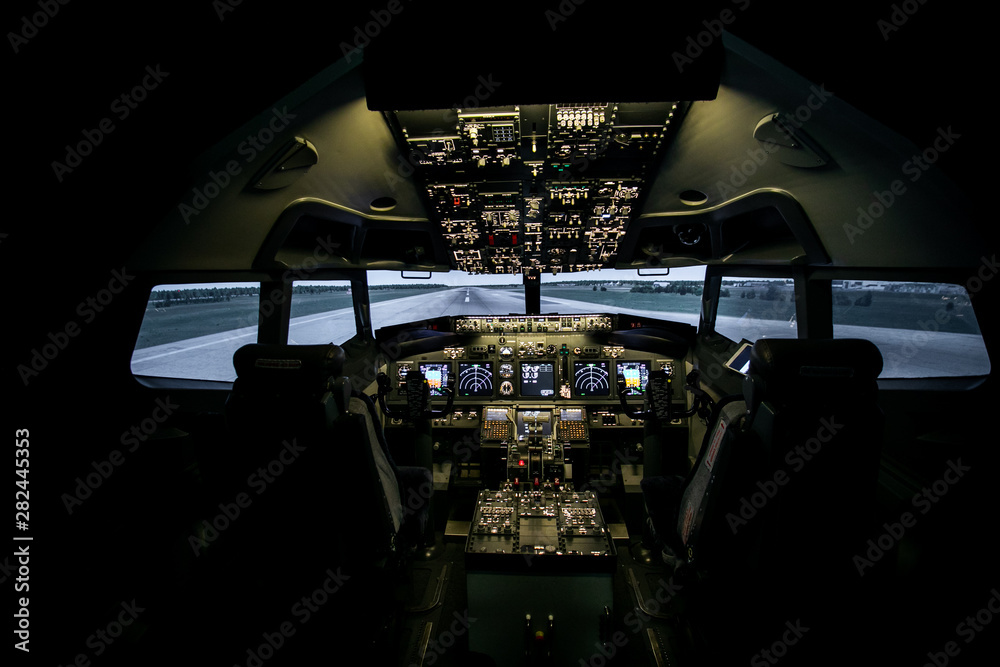 Aircraft interior, cockpit view inside the airliner. Point of view from ...