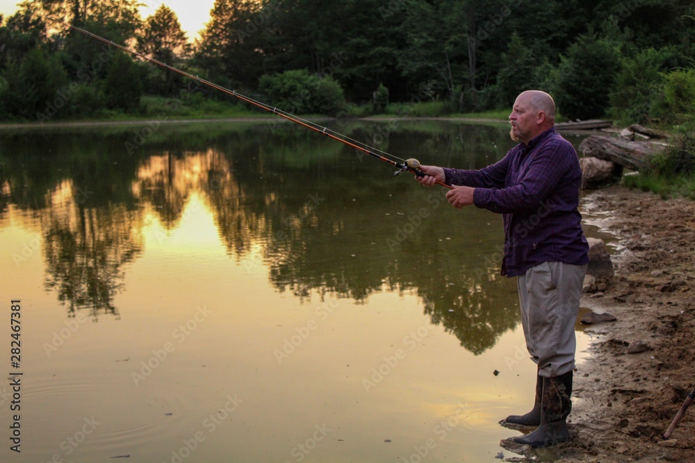 Man Fishing On Pond