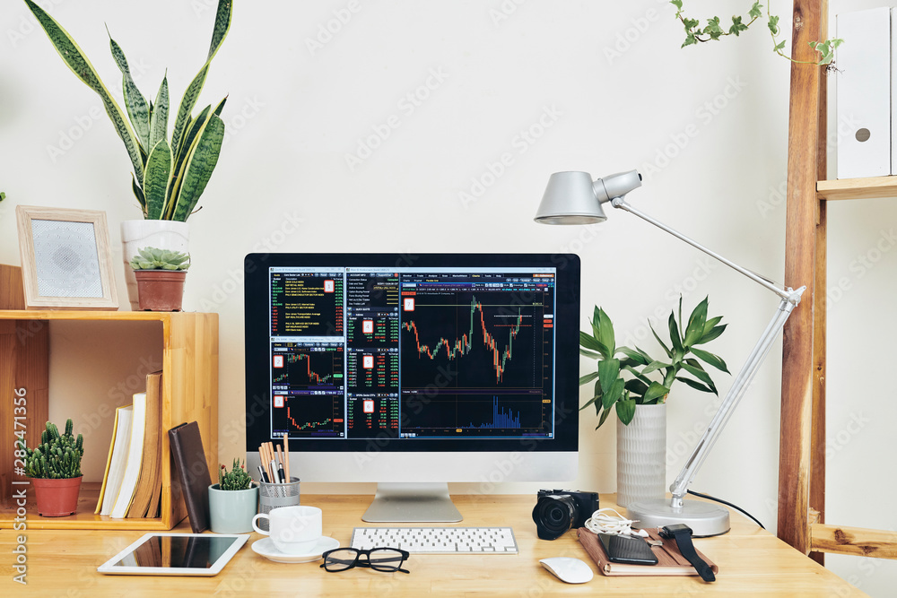 Charts depecting stock market changes on screen of computer on office ...