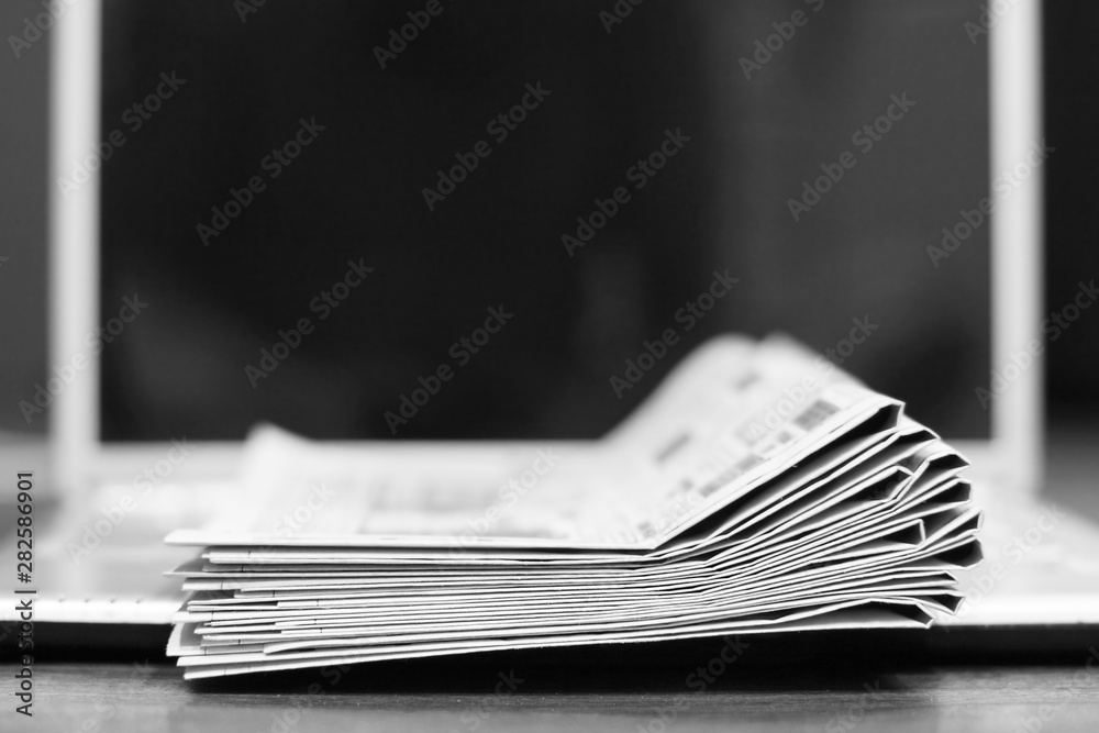 Newspapers and Laptop. Different Concepts for News - Social Network or ...