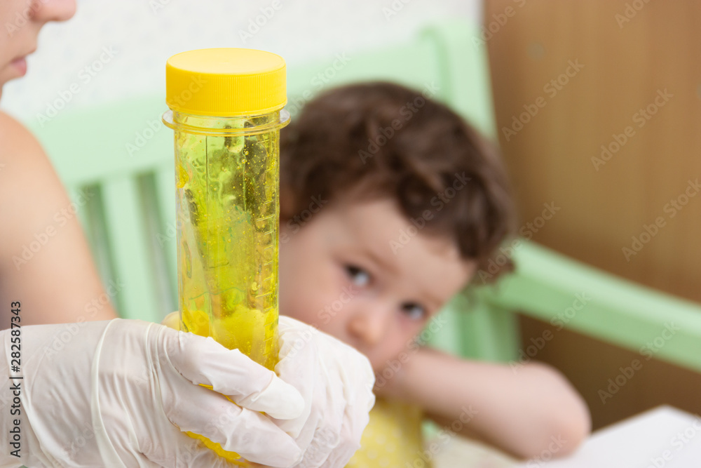 how to make slime. Mother and child mix ingredients homemade goop ...