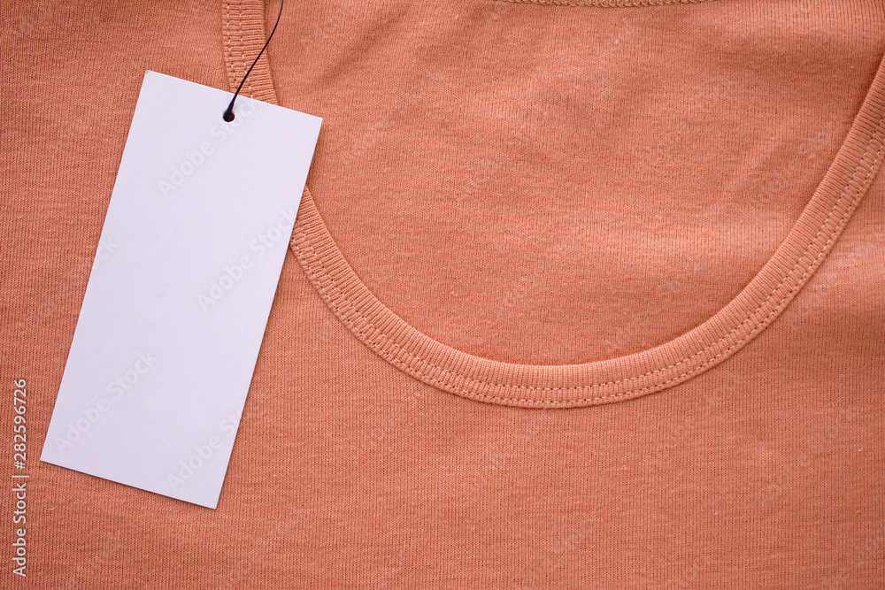 Blank white clothes tag label on new shirt Stock Photo | Adobe Stock
