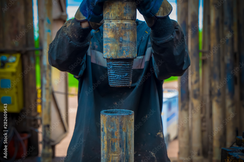 Offshore oil rig worker prepare tool and equipment for perforation oil ...