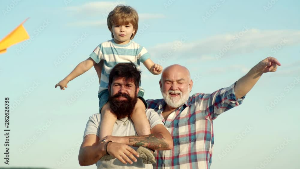 Father son and grandfather playing - family time together. Three men ...