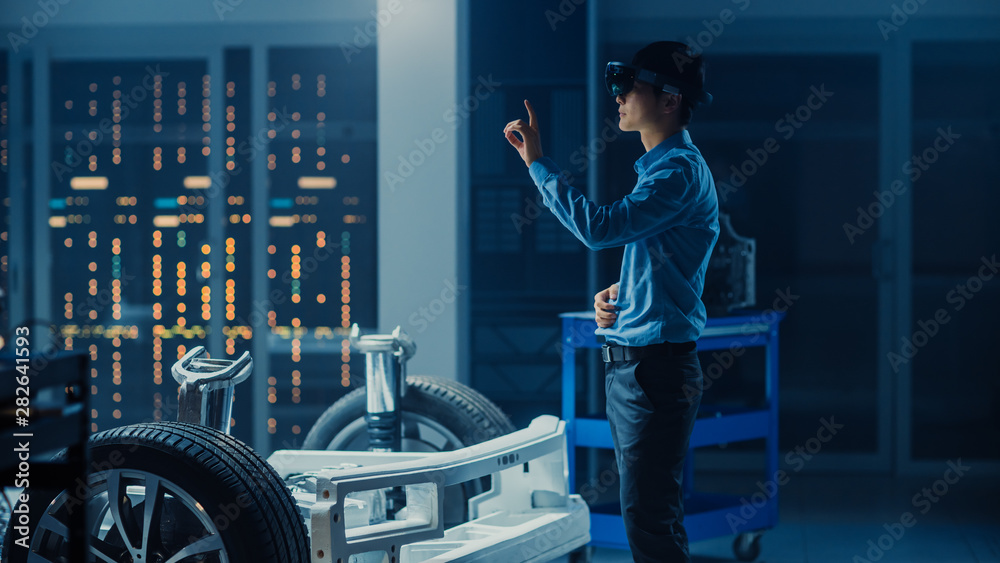 Automotive Engineer Working on Electric Car Chassis Platform, Using ...