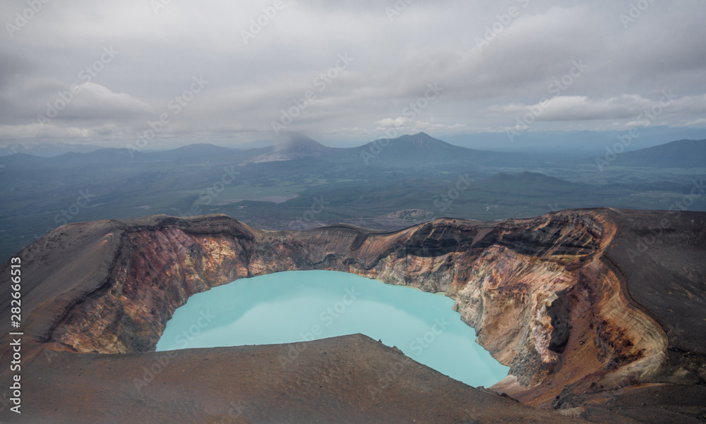 Karymsky Lake, a crater pool located in the Karymsky volcano on the ...