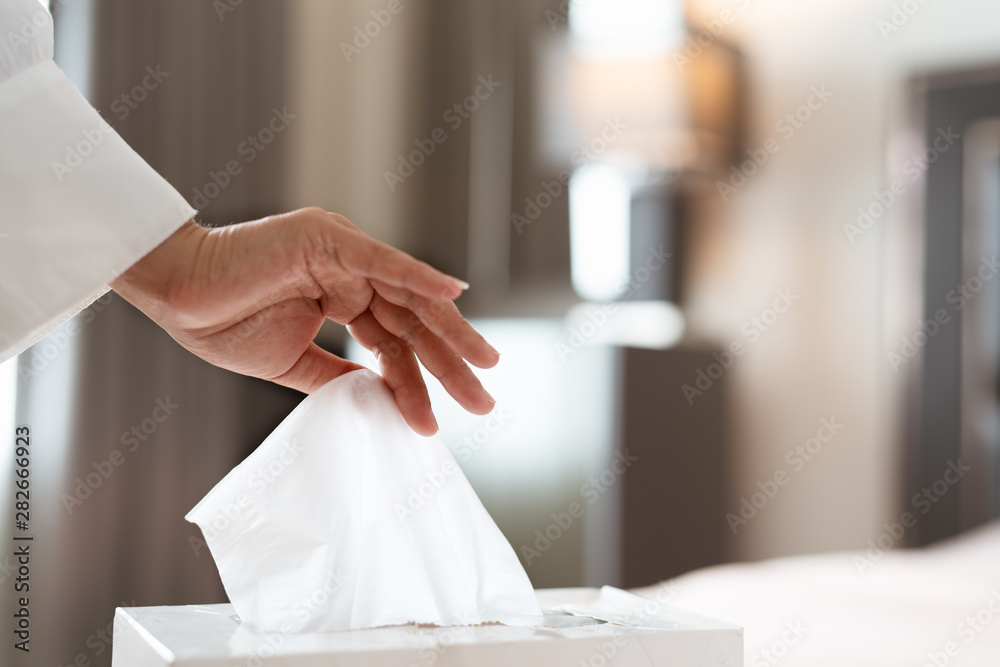 women hand picking napkin/tissue paper from the tissue box Stock Photo ...