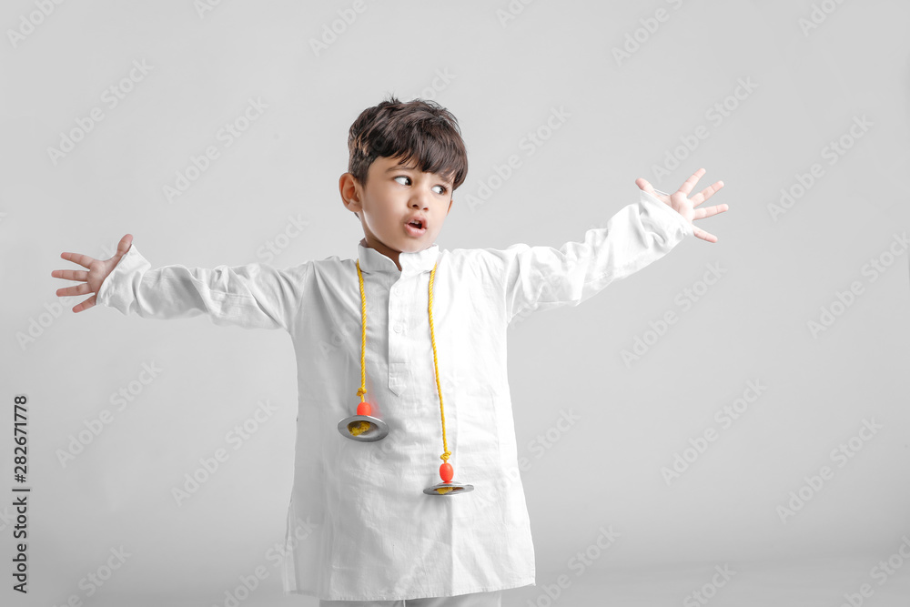 Indian Little Boy in Traditional Dress and learning with Musical ...