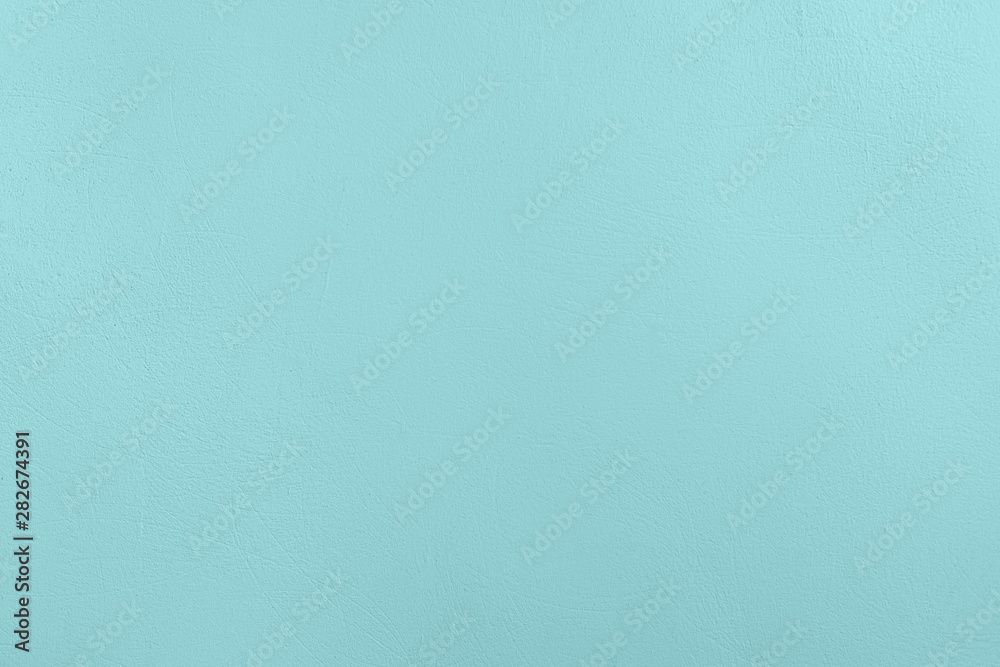 Pale blue colored low contrast Concrete textured background with ...