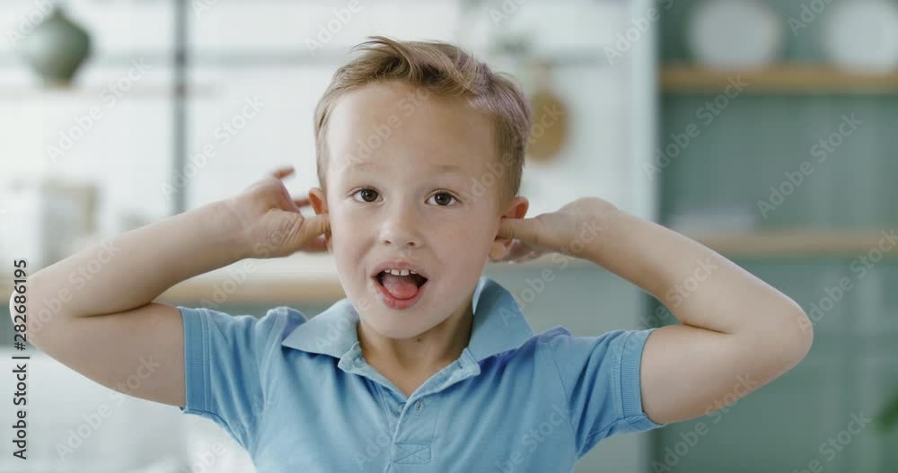 FIXED Portrait of little cute Caucasian kid boy doing silly funny face ...