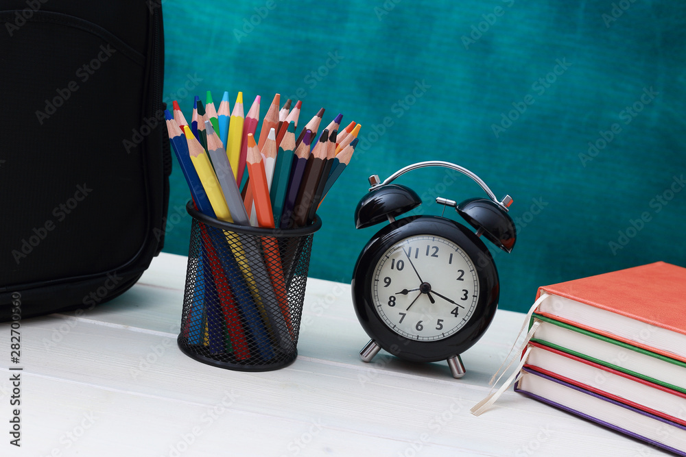 Back to school concept. School bag, pencils, crayons, scissor ...
