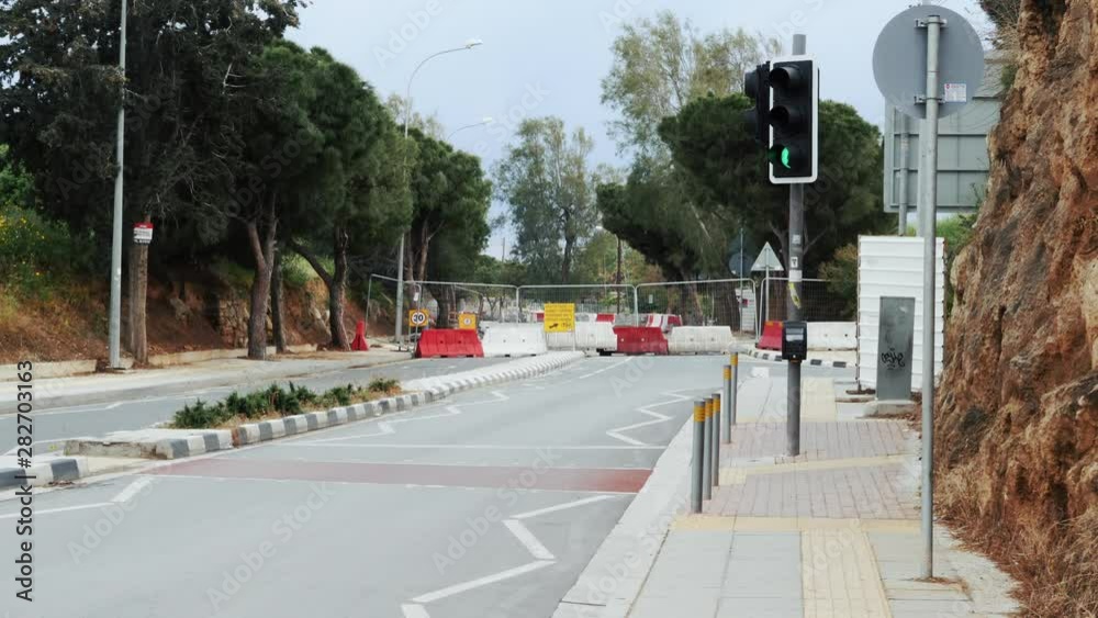 Roadblock ahead. Road under construction blocked by barriers with ...
