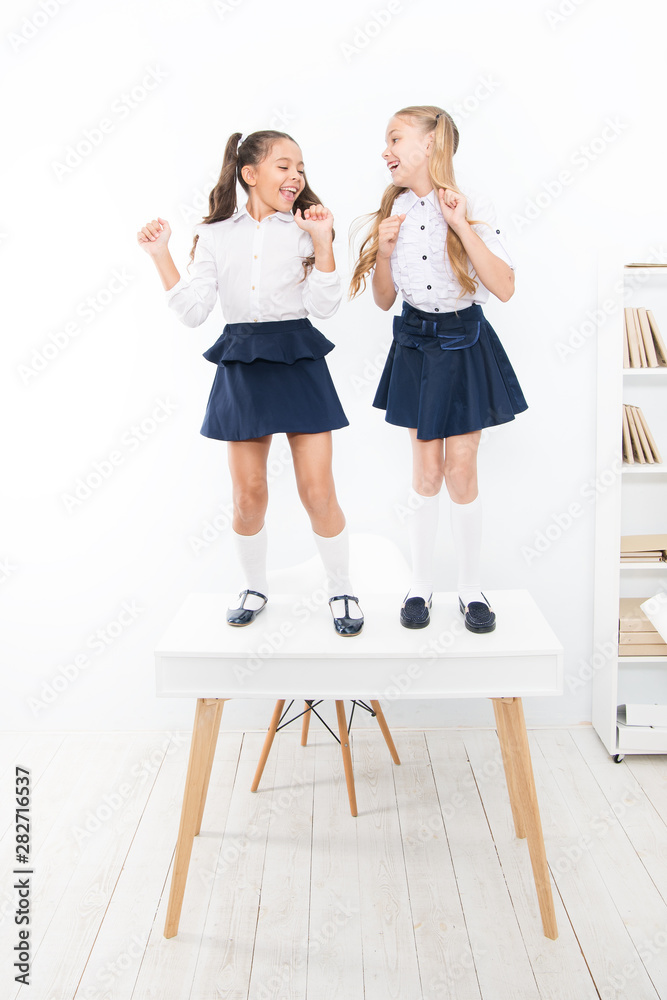 On same wave. On the top. Popular girls in classroom. School friendship ...