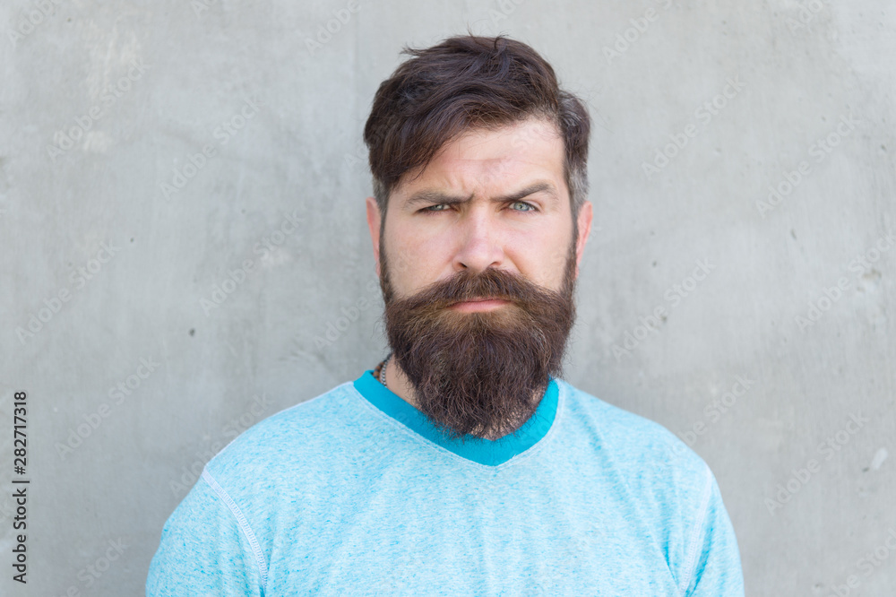 His beard and a haircut are styled. Bearded man wearing stylish ...
