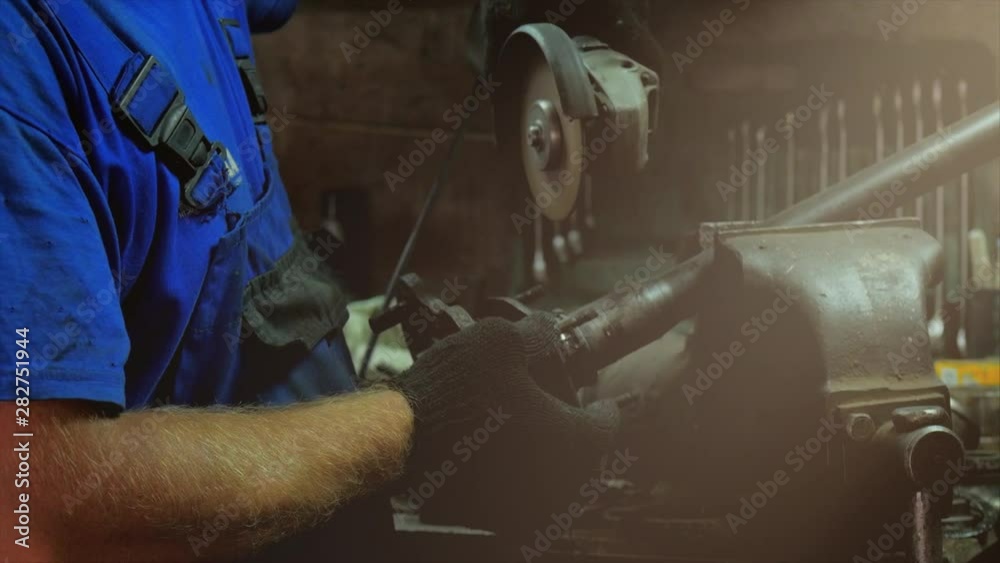 Craftsman Working With a Circular Saw, Sparks Fly From the Hot Metal ...