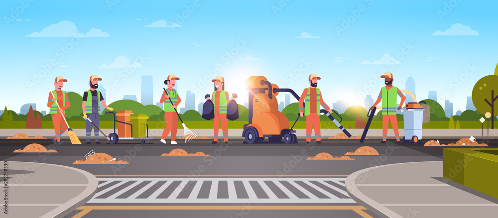 janitors team gathering trash on road cleaners using vacuum cleaner ...