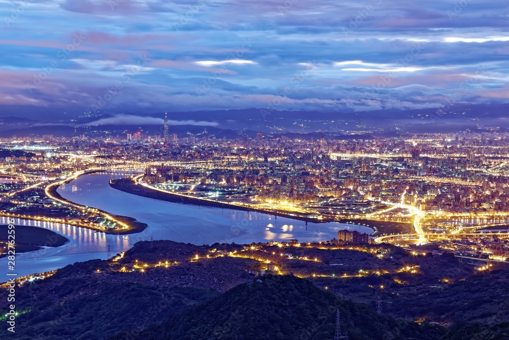 Aerial panorama over Taipei, the capital City of Taiwan, on a blue ...