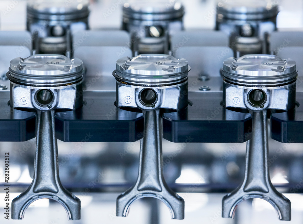 New pistons on the rack at automobile assembly line production plant ...