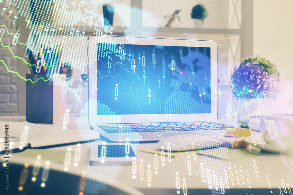 Stock market graph on background with desk and personal computer. Multi ...