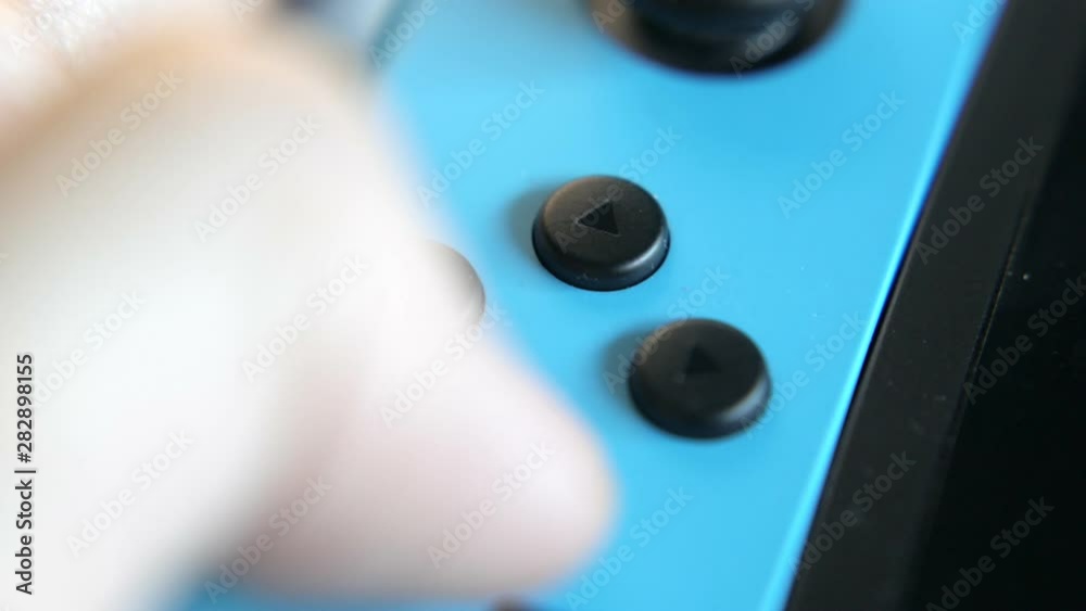Gamer playing video game by using game controller Stock ビデオ | Adobe Stock