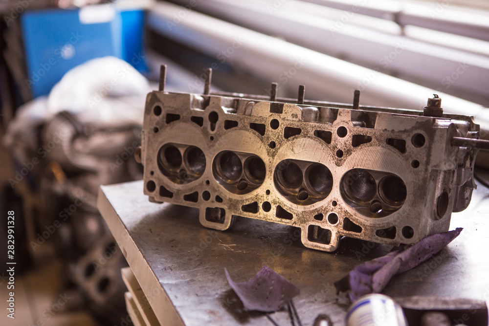 Car engine disassembled separately from the machine. The process of ...