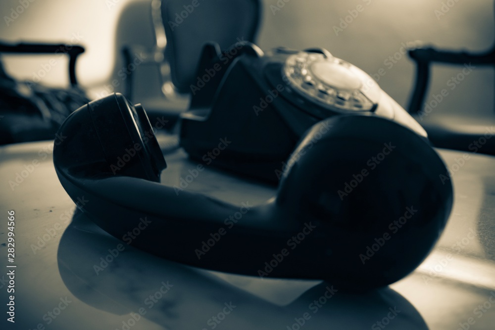 Old black telephone. Nostalgic classic equipment. Grainy vintage aged ...