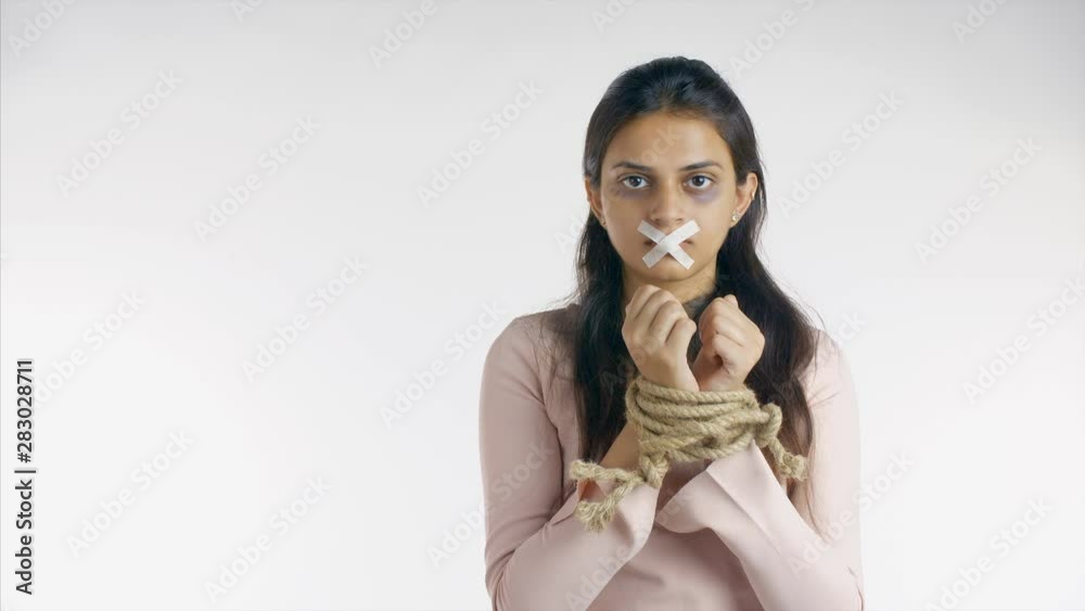Vídeo do Stock: Kidnapped Indian woman roughly tied up with rope - Human Trafficking concept ...