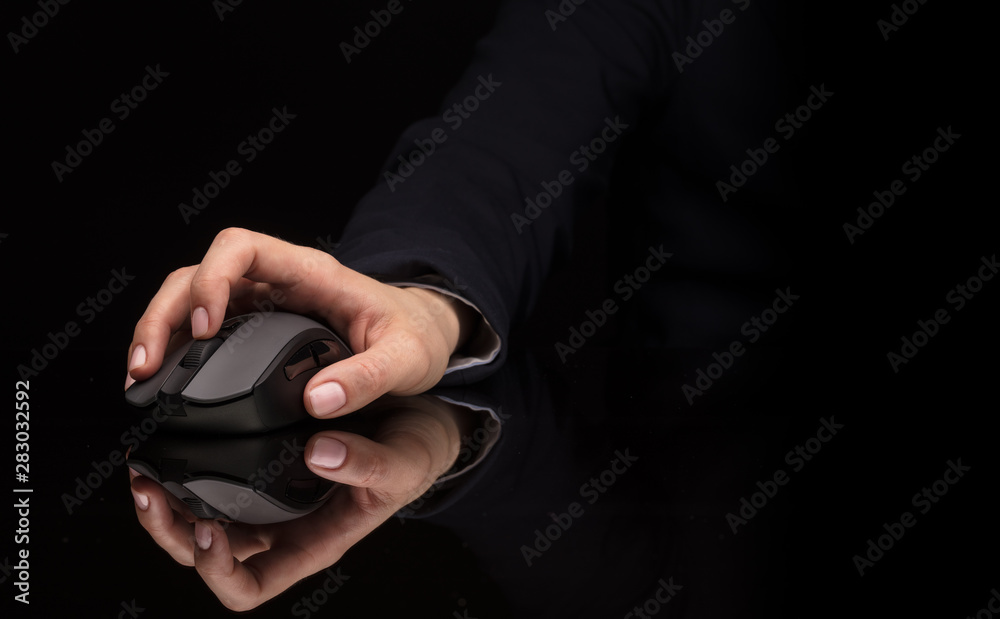 Hand using wireless mouse in a dark environment Stock Photo | Adobe Stock
