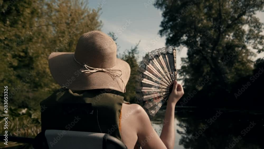 Girl Swimming On Kayak And Using Chinese Fan In Slow Motion.Tourist ...