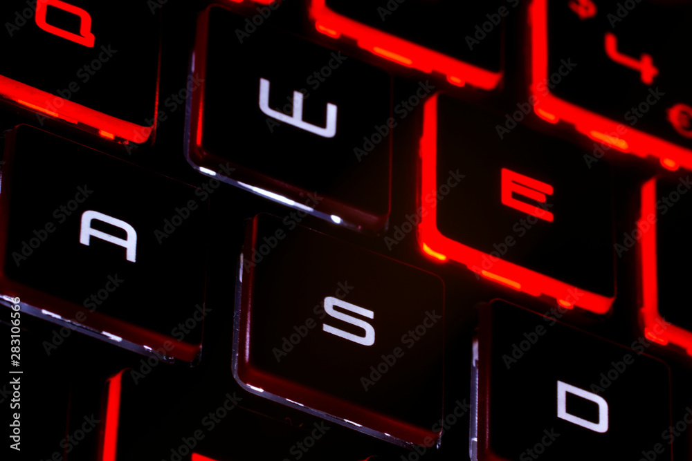 Red backlit keyboard on black background. High resolution image for ...