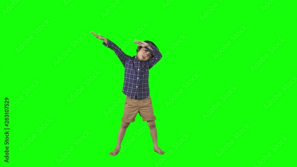 Little boy dancing dab or making dab gesture in the studio. Shot in 4k ...