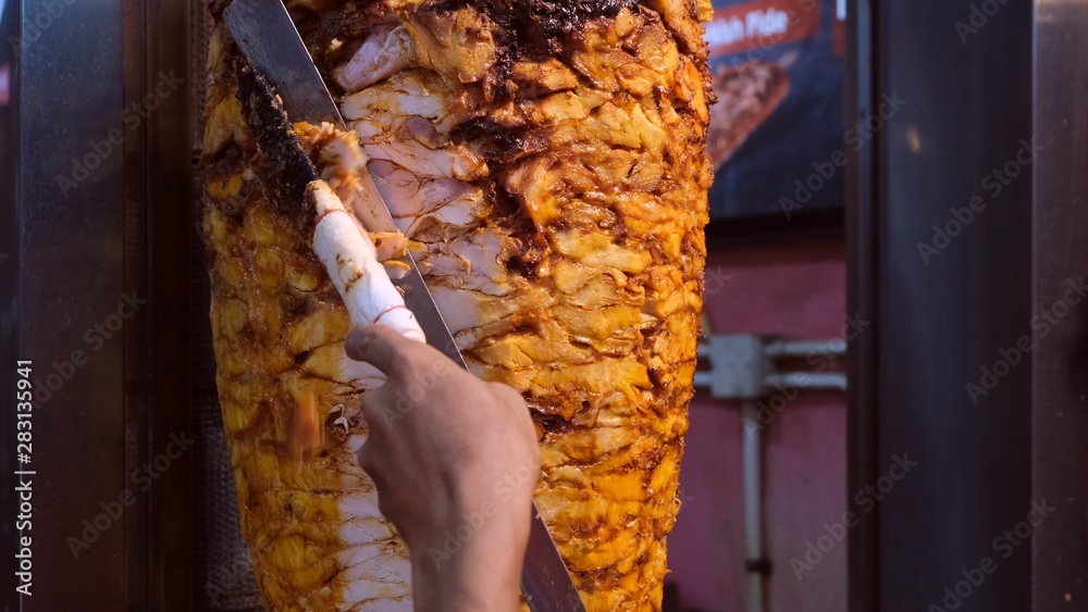 Shawarma. Closeup picture of stacked meat roasting, shawarma. Stock ...