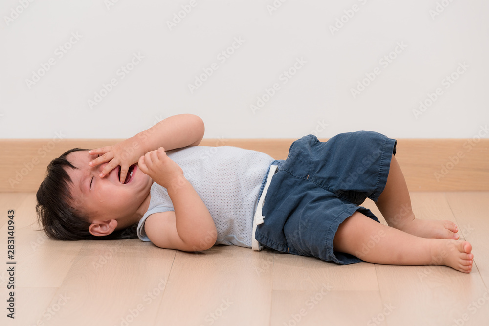 Asian little boy cry and lying on floor Stock Photo | Adobe Stock