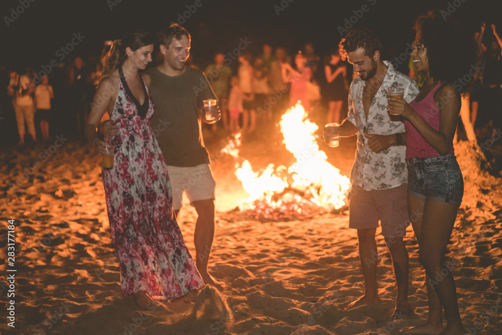 Happy friends drinking beer at beach music festival - Young people ...