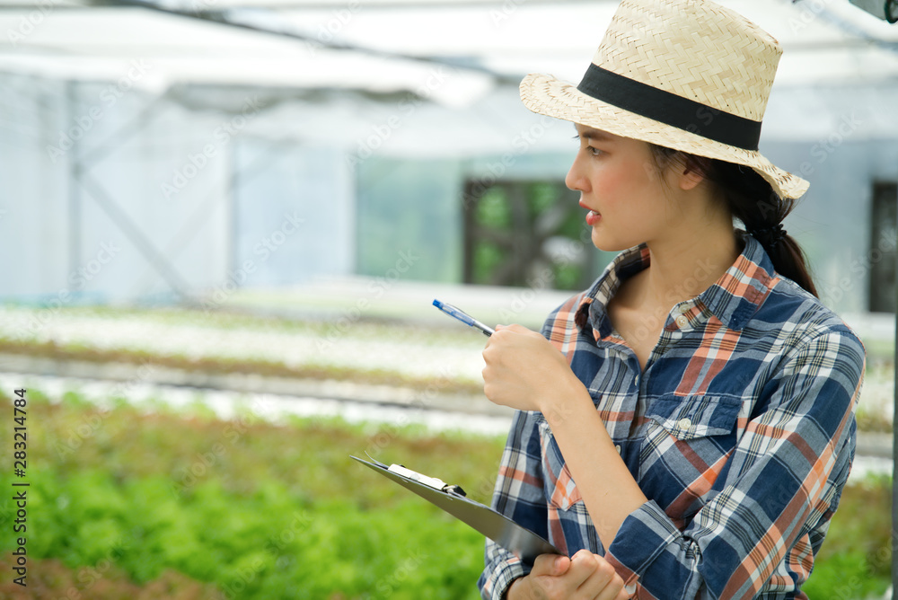 Young Asian farmer pretty girl checking quality and quantity of ...