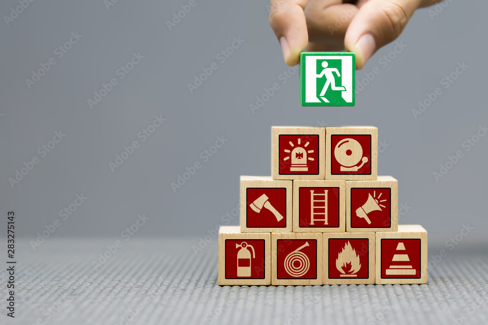 Wood block Stacking with Fire and safety icons. Stock Photo | Adobe Stock