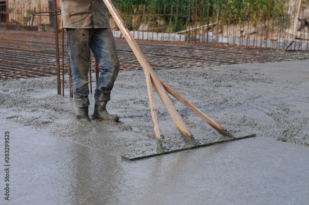 Concrete pouring during commercial concreting floors of buildings in ...